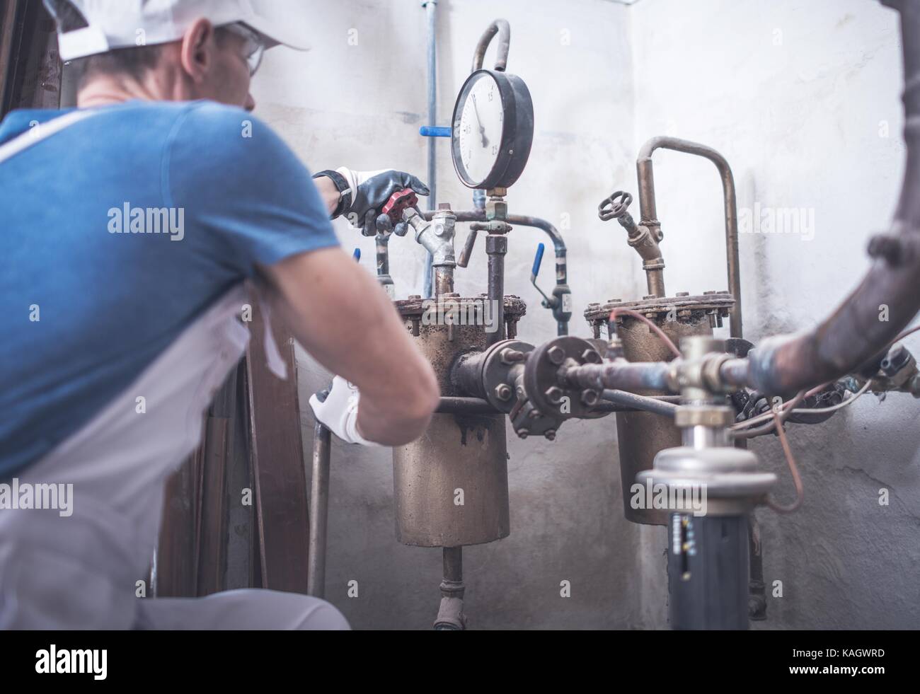 Plumbing Worker Job. Caucasian Plumber Checking on Water Heating ...