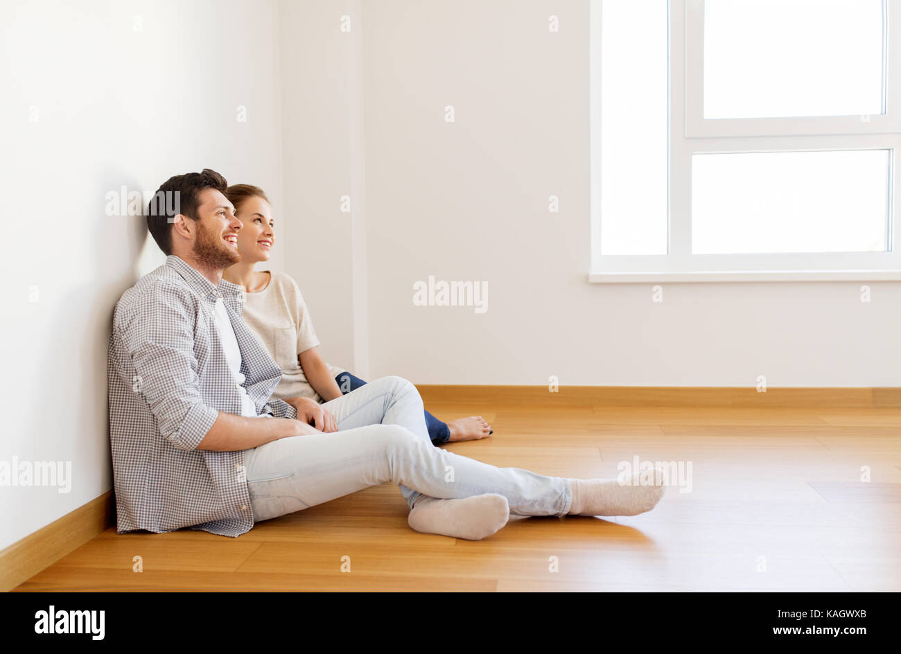 happy couple at empty room of new home Stock Photo - Alamy