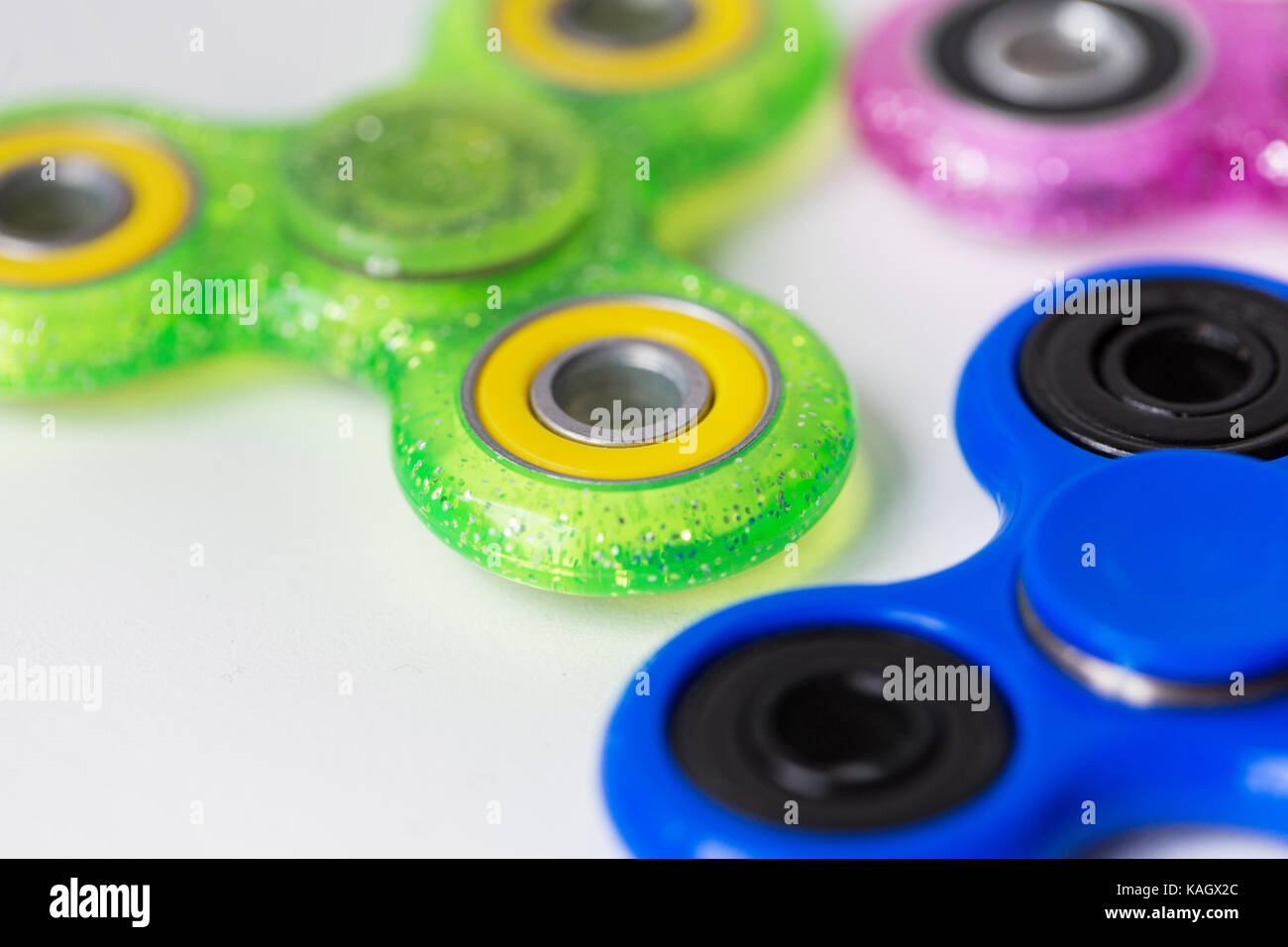 close up of fidget spinners on white background Stock Photo - Alamy