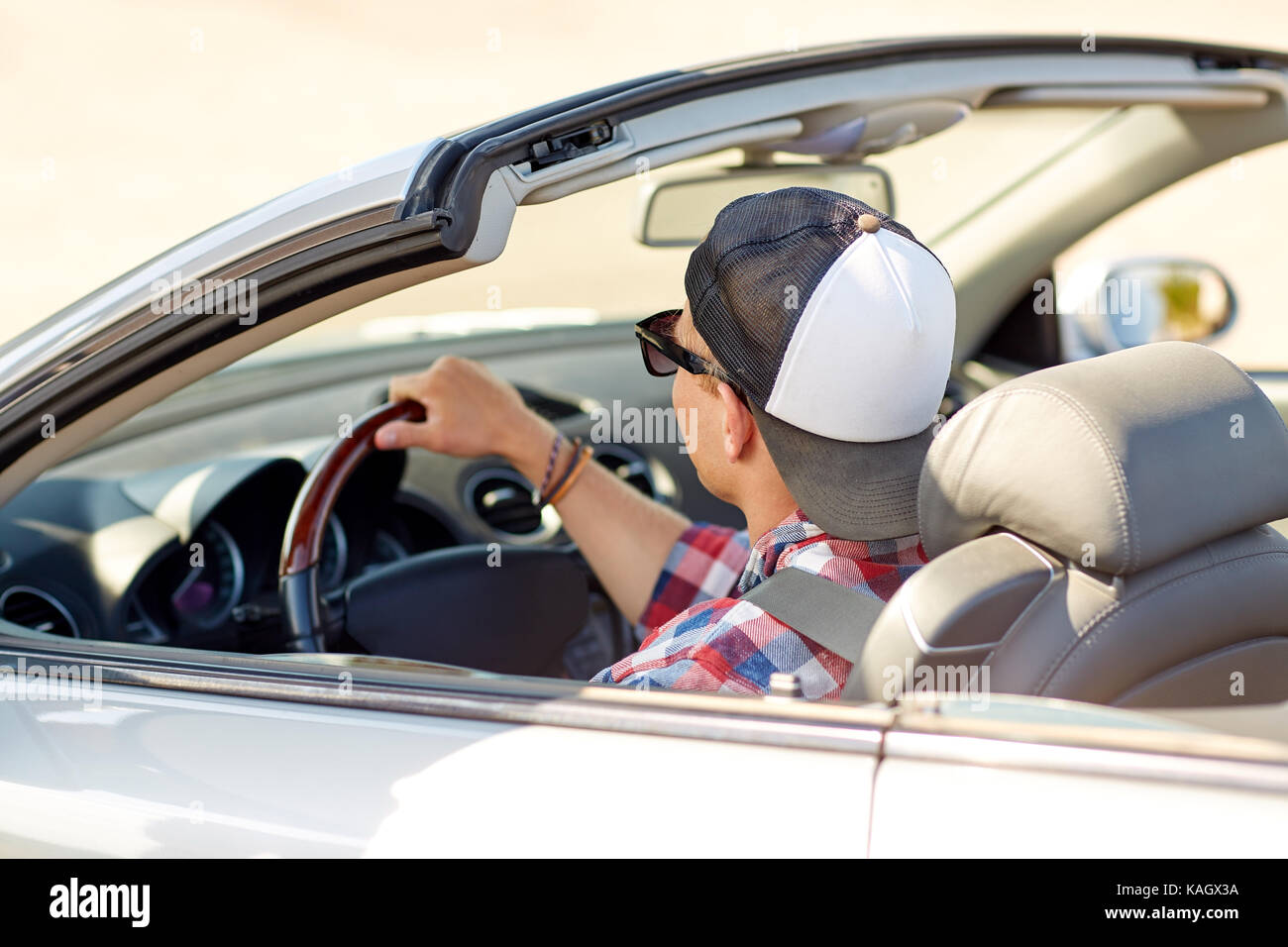 happy young man in shades driving convertible car Stock Photo - Alamy