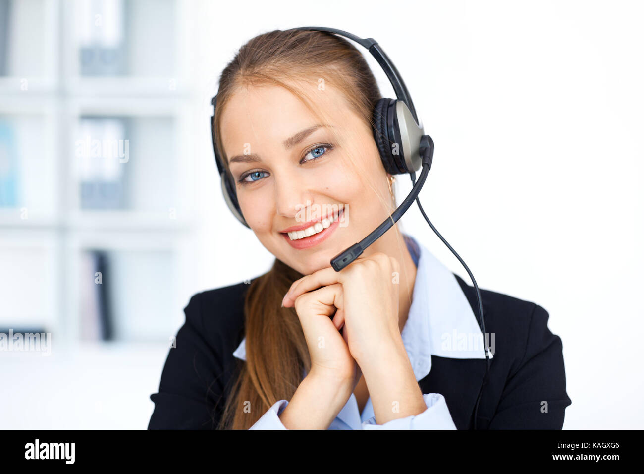 Portrait of pretty young female operator Stock Photo - Alamy