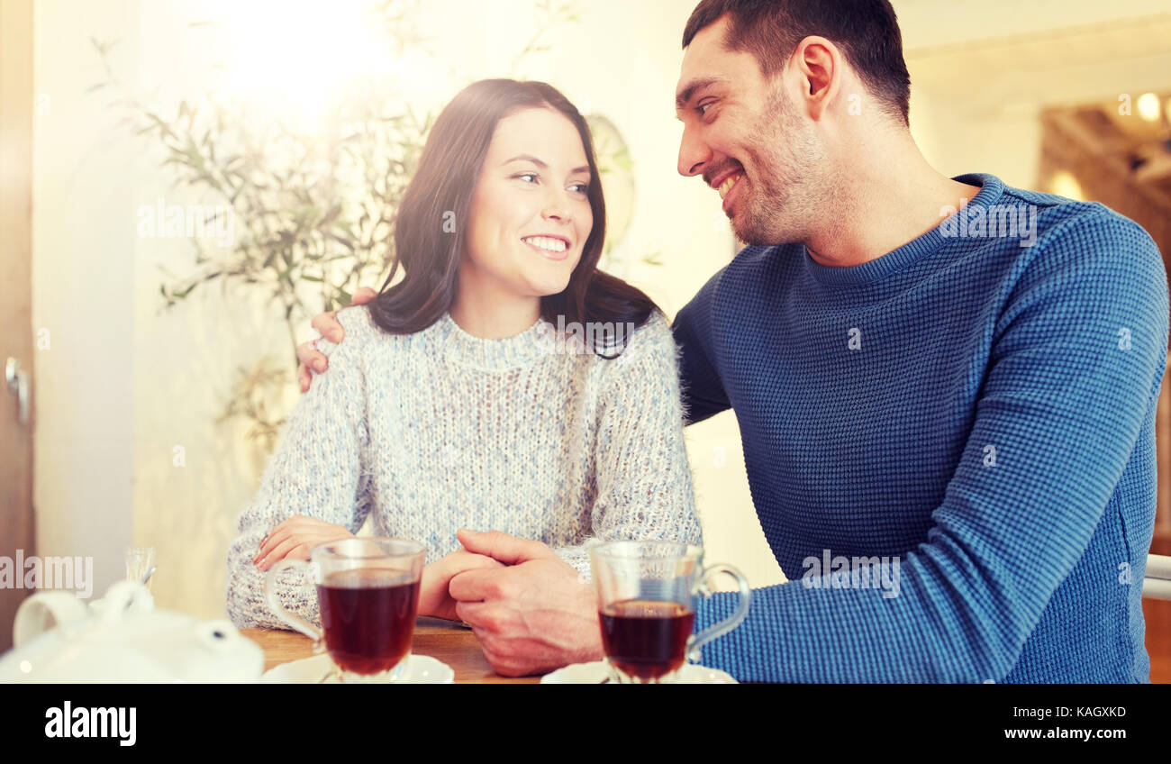 happy couple drinking tea at restaurant Stock Photo - Alamy