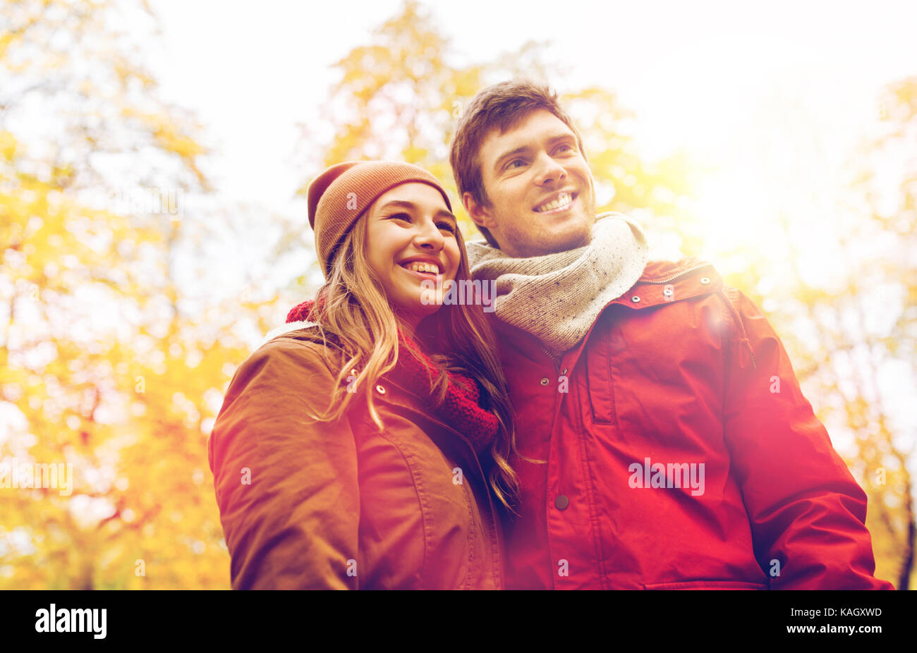 happy young couple walking in autumn park Stock Photo - Alamy