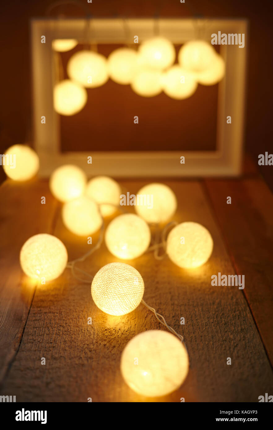 Wooden frame and garland. Abstract composition Stock Photo - Alamy