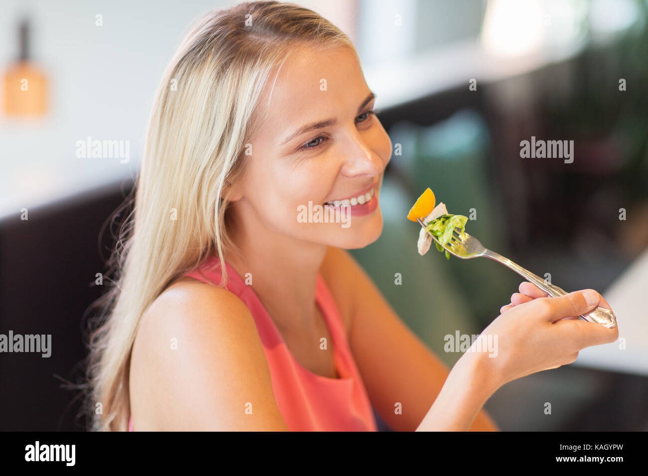 Woman eating happy restaurant hi-res stock photography and images - Alamy