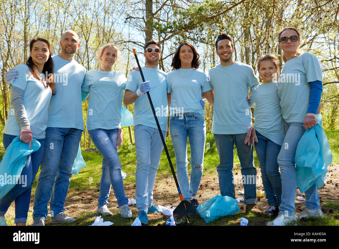volunteers with garbage bags cleaning park area Stock Photo - Alamy