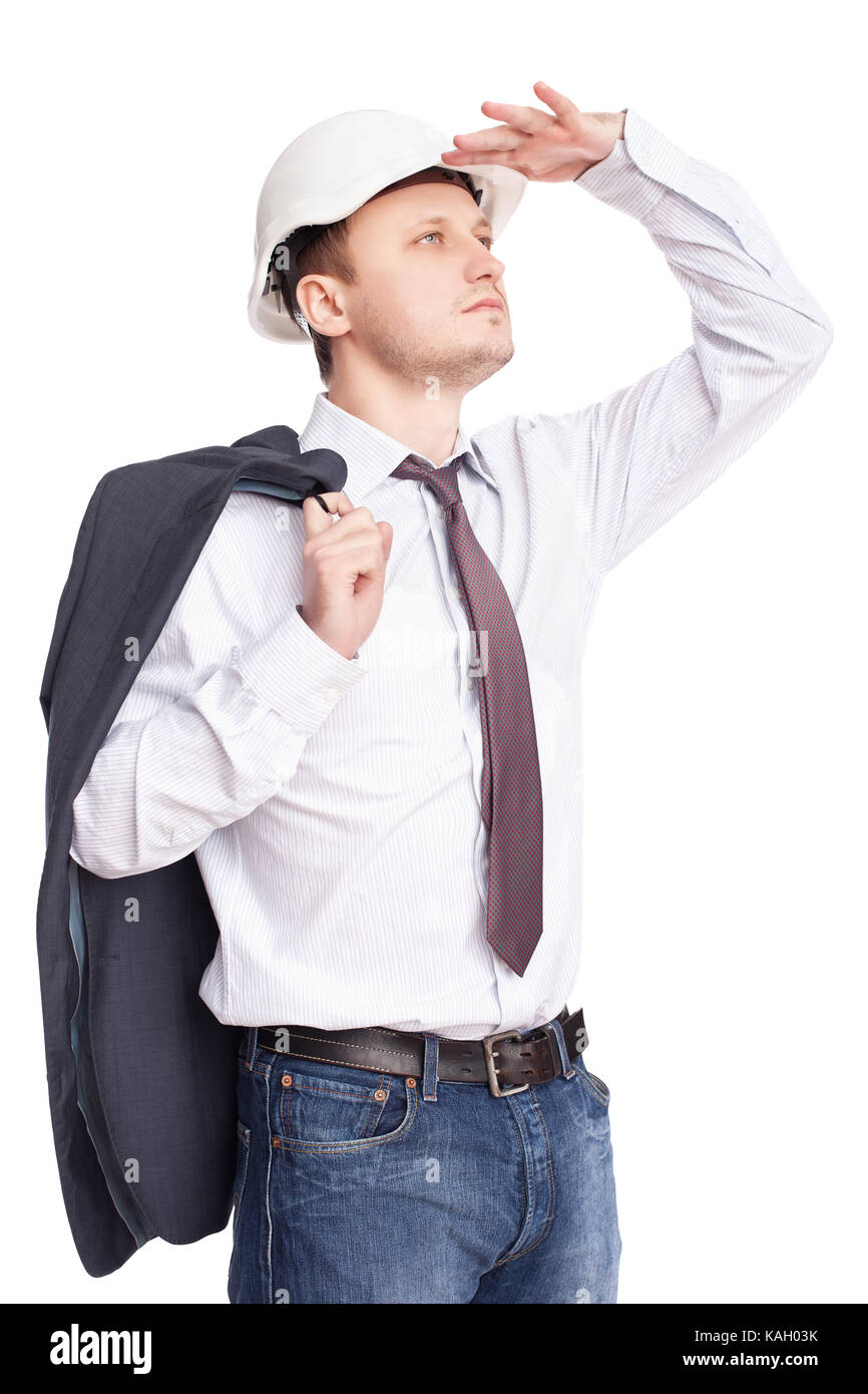 Young engineer looking far away holds jacket behind shoulder isolated ...