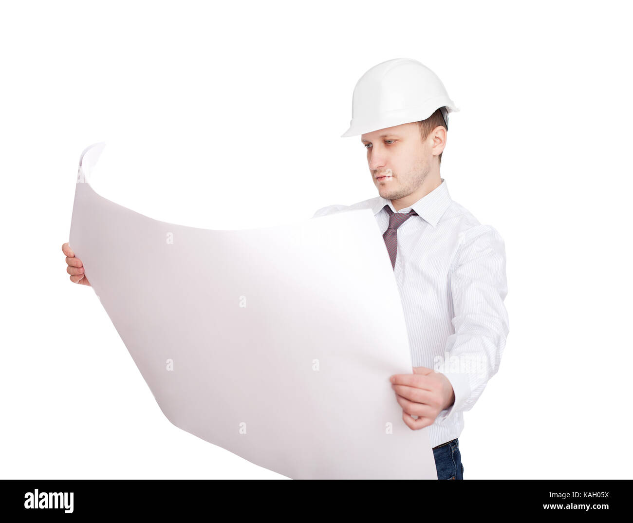Young engineer looking at blueprint isolated on white background Stock ...