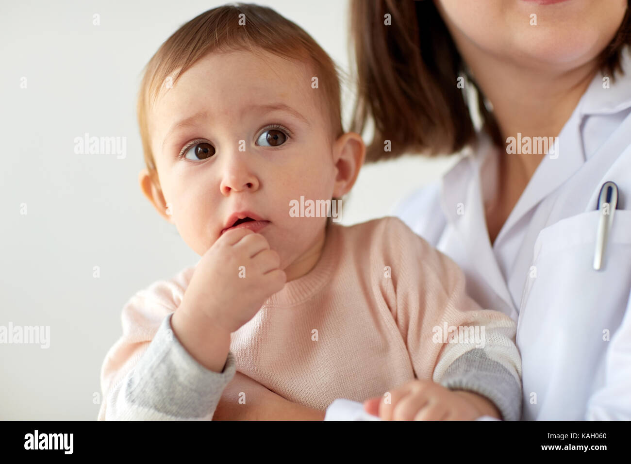 doctor or pediatrician with baby on medical exam Stock Photo - Alamy