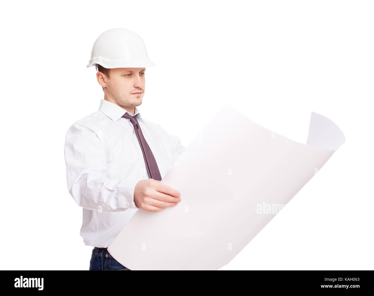 Young engineer looking at blueprint isolated on white background Stock ...