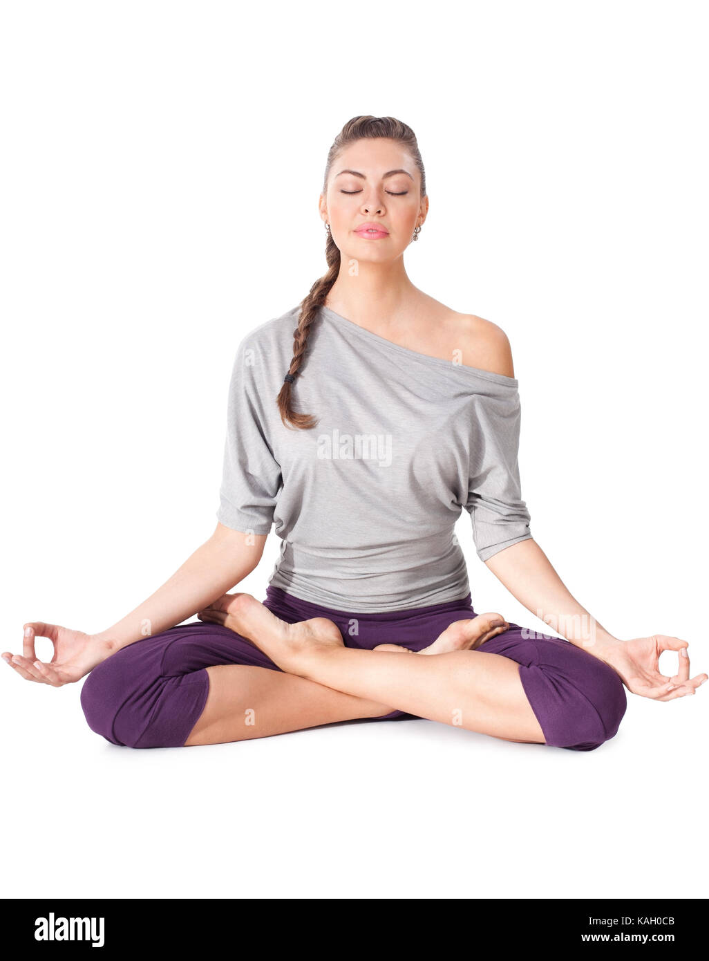 Young woman doing yoga exercise Padmasana (Lotus Pose). Isolated on ...