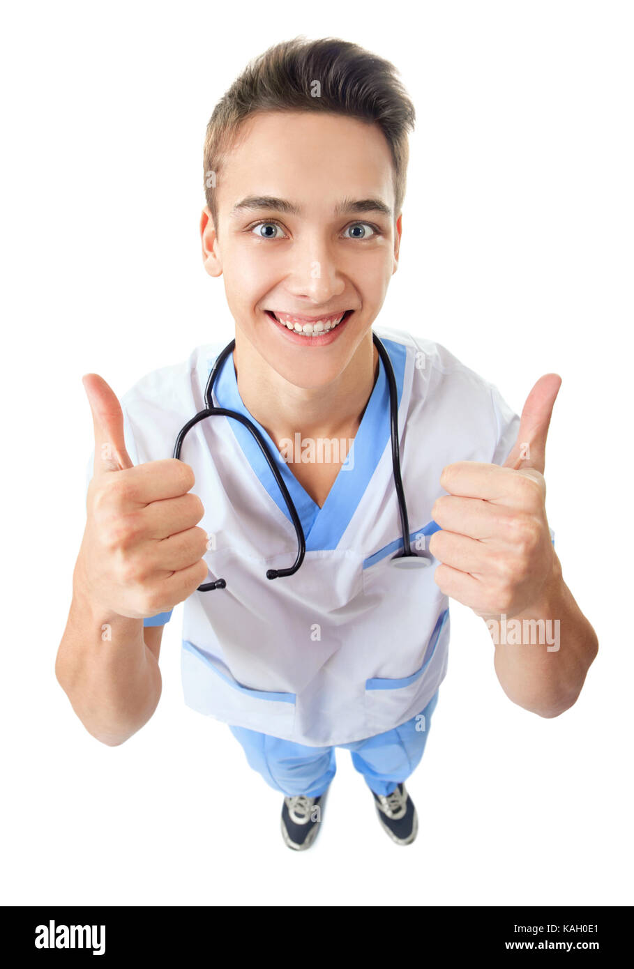 Wide angle top view of funny young doctor showing thumbs up isolated on ...
