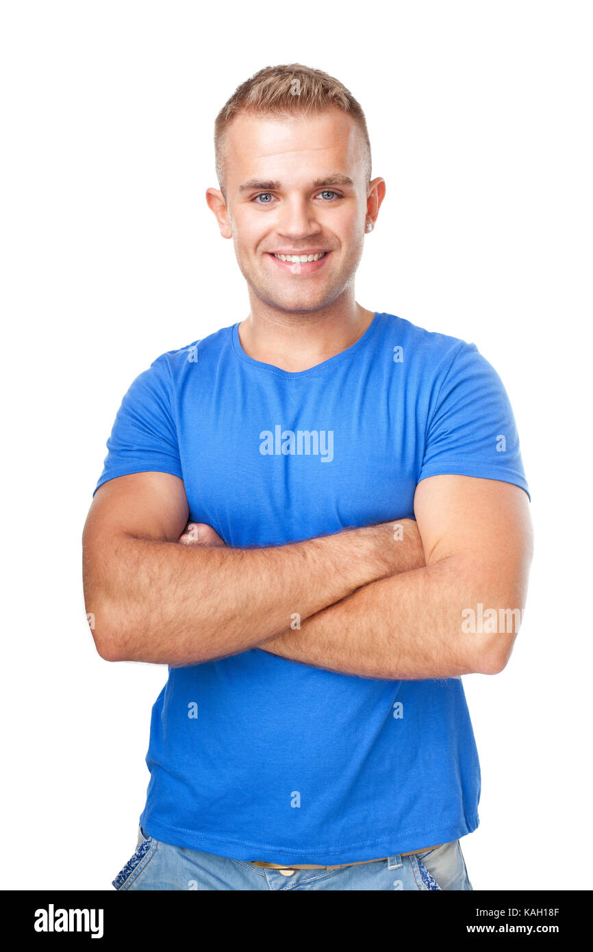 Portrait of happy smiling man standing with hands folded against ...