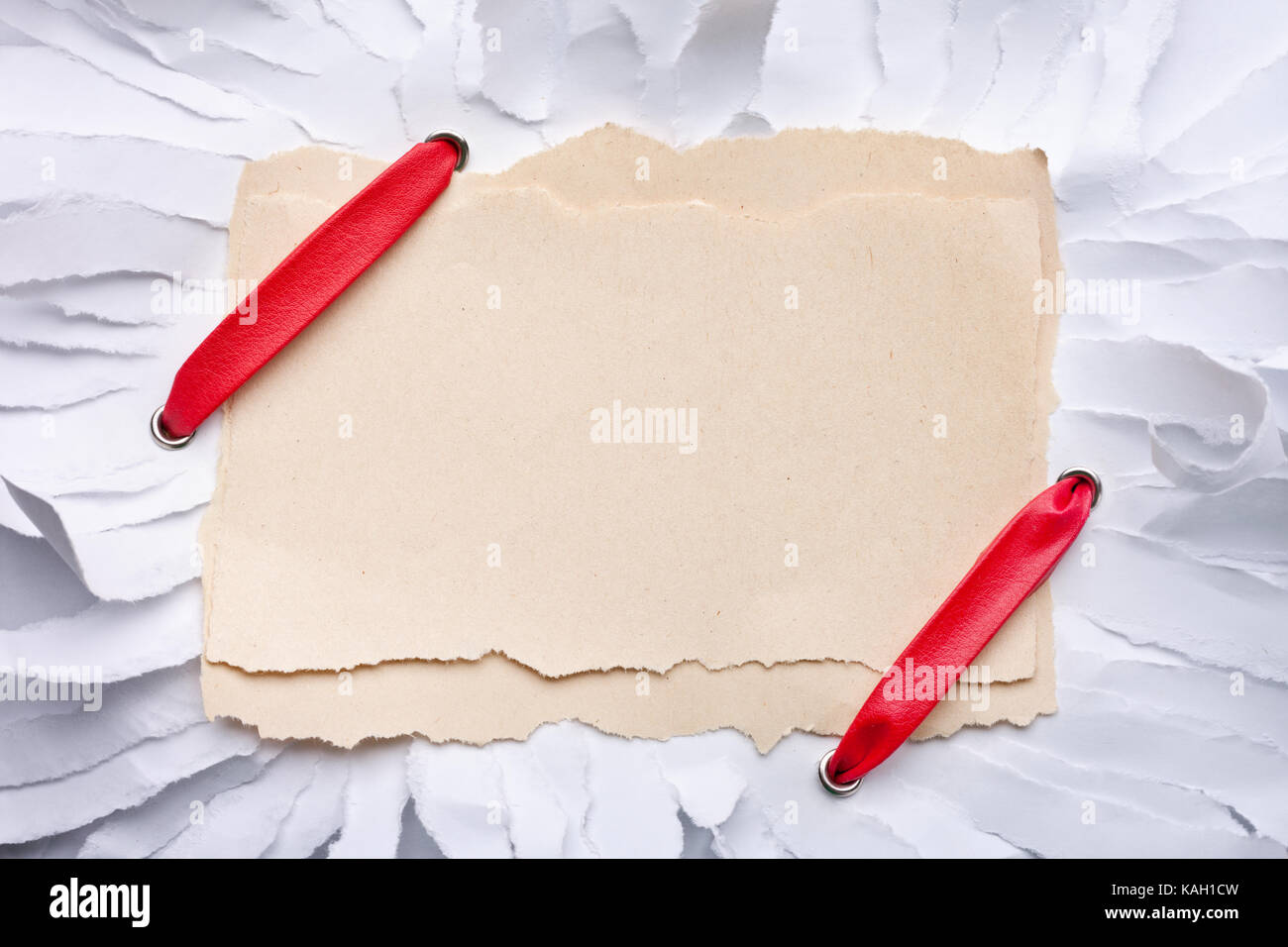 ripped piece of paper with red ribbon. Handmade card Stock Photo - Alamy