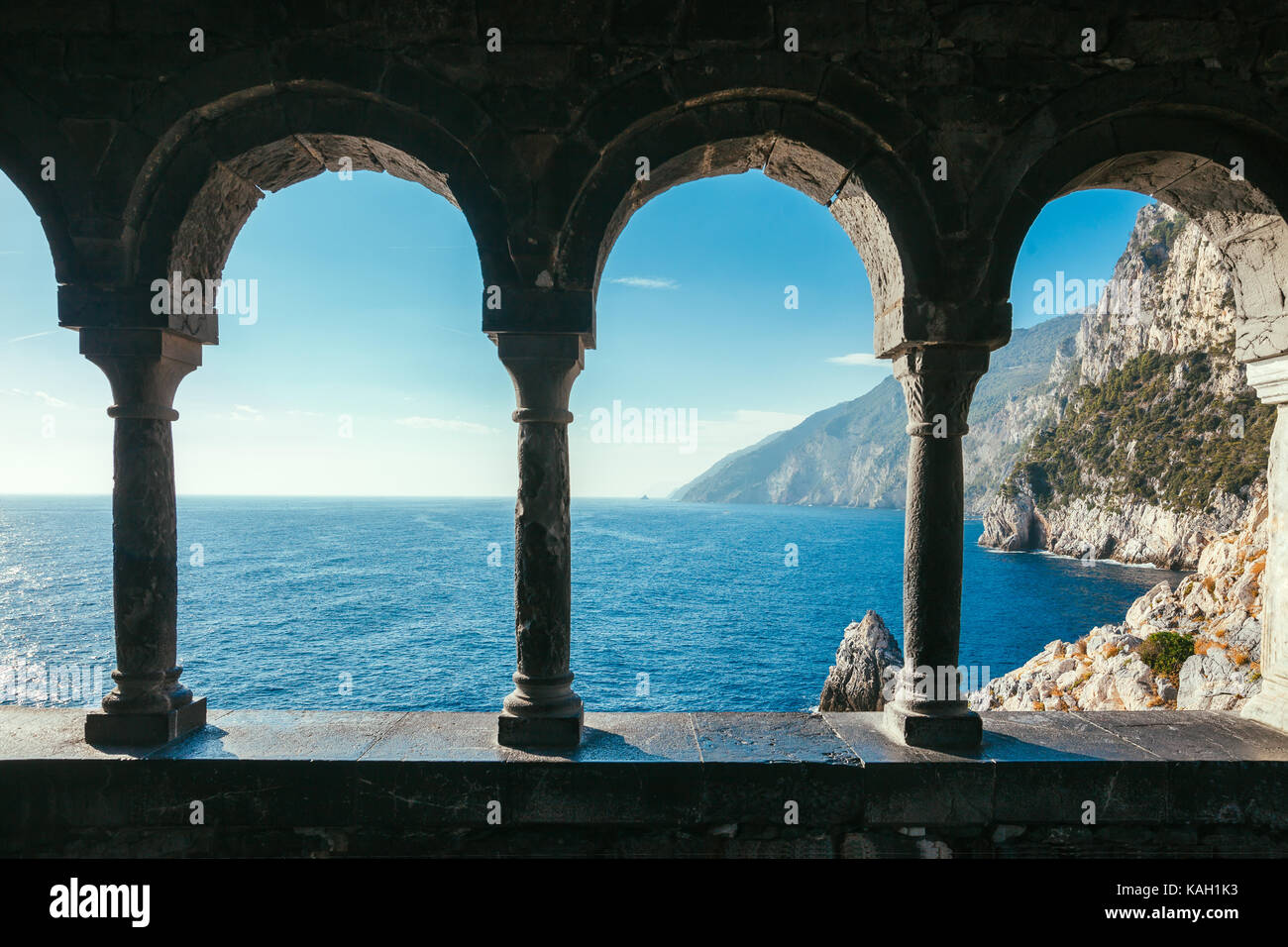 Terrace with arches overlooking scenic sea view and mountains in Italy ...