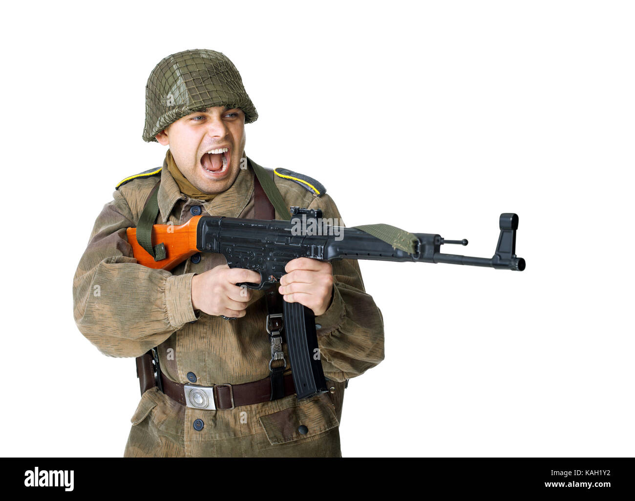 Soldier shoots submachine gun isolated on white background Stock Photo ...