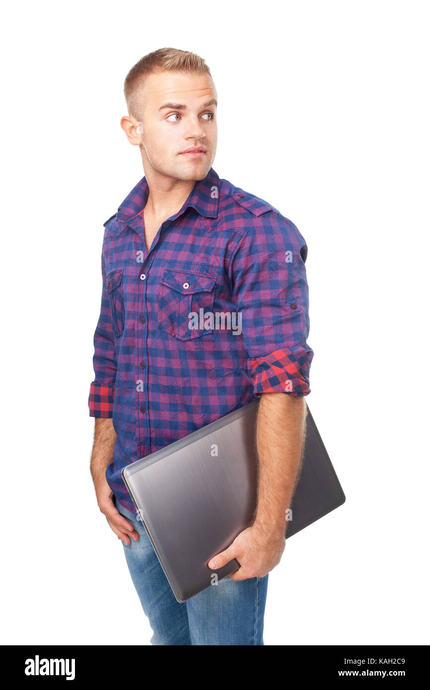 Portrait of happy smiling young man holding laptop isolated on white ...
