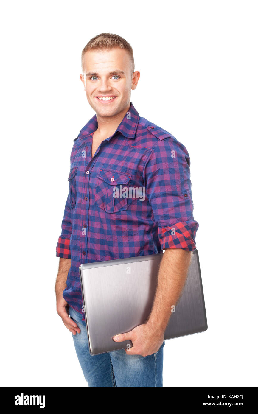 Portrait of happy smiling young man holding laptop isolated on white ...