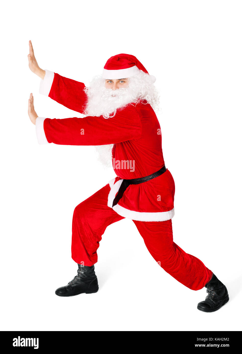 Santa Claus pushing something isolated on white background Stock Photo ...