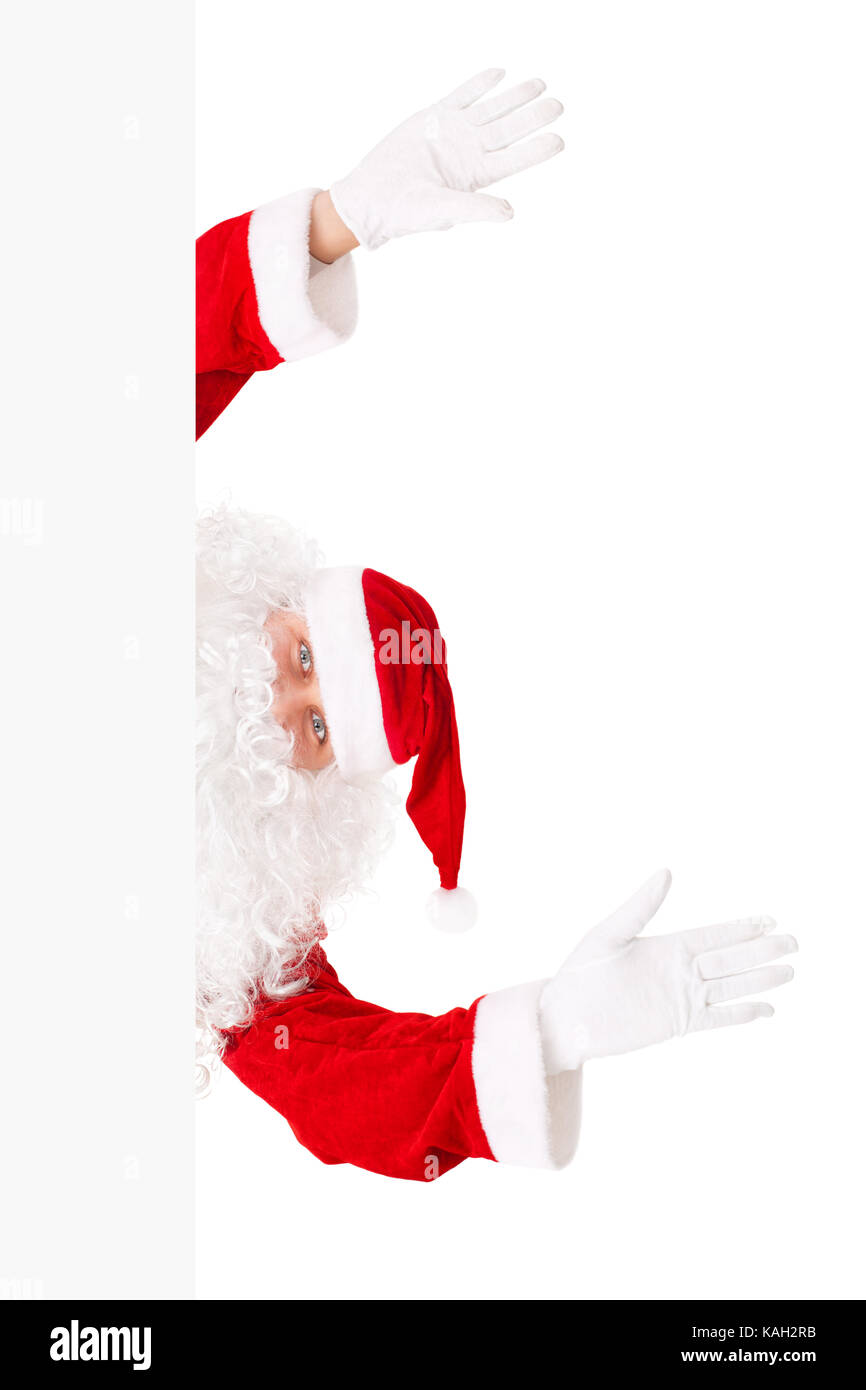 Santa Claus is looking out of white board isolated on white background ...