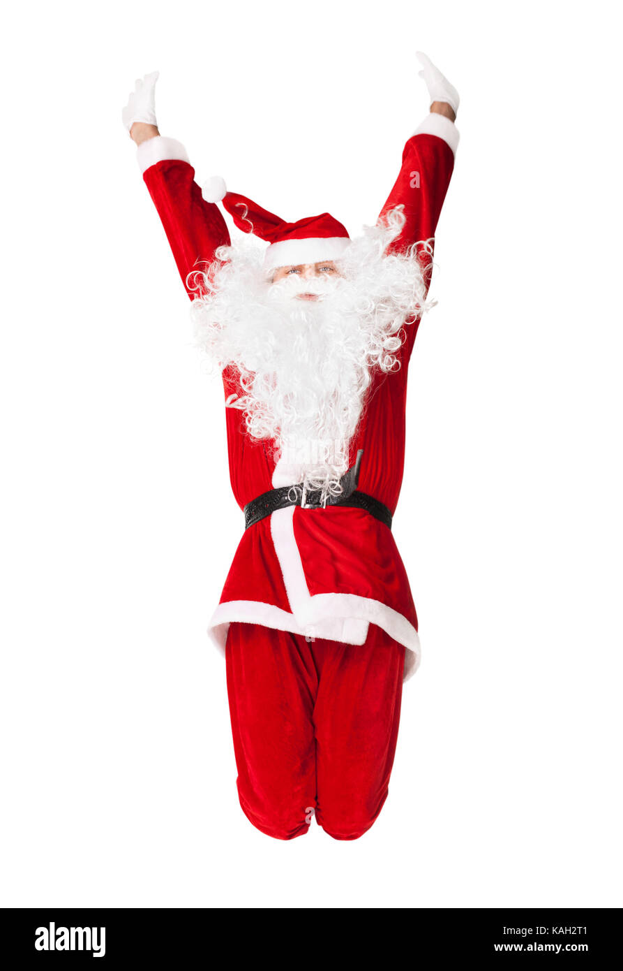 Santa Claus jumping isolated on white background Stock Photo - Alamy