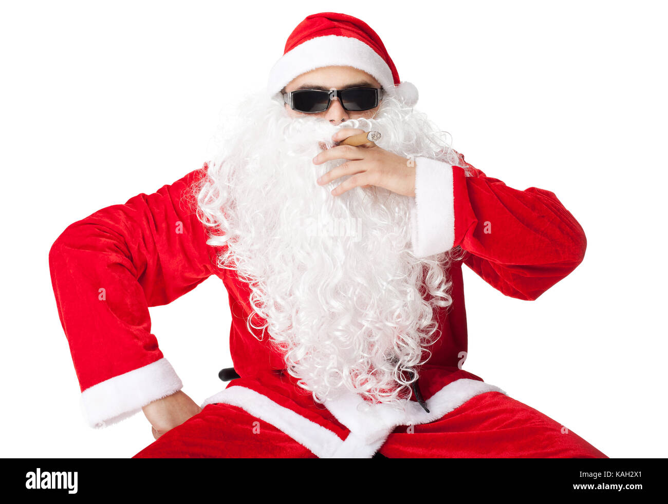 Santa Claus wearing sunglasses and smoking a cigar isolated on white ...
