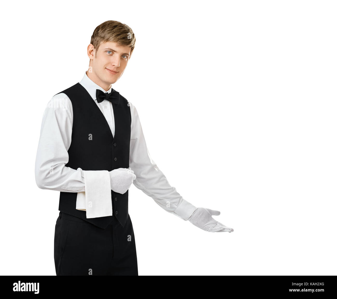 Portrait of young handsome waiter gesturing welcome isolated on white ...