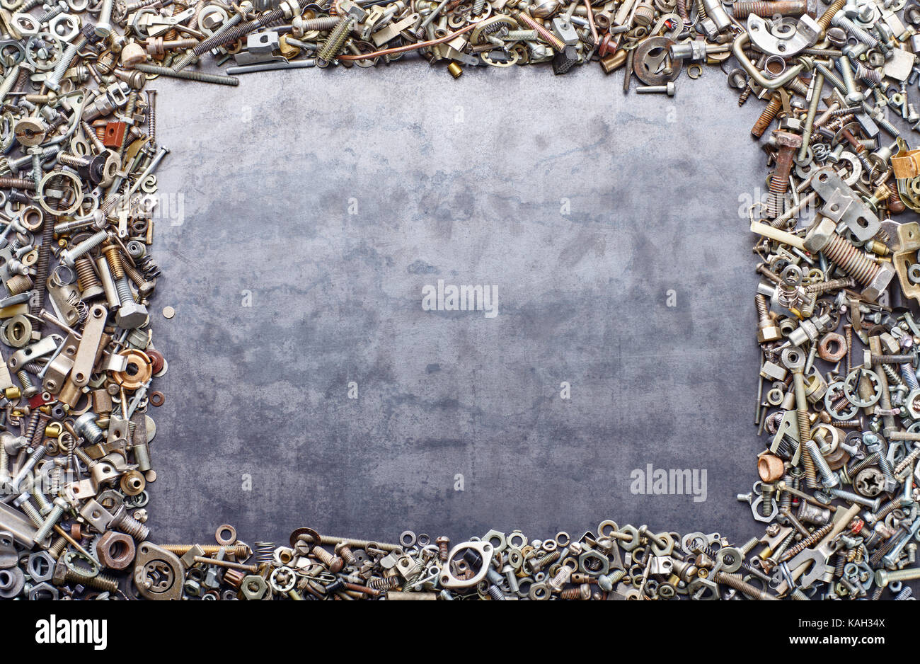 assorted screw nuts and bolts frame on metal texture background Stock ...