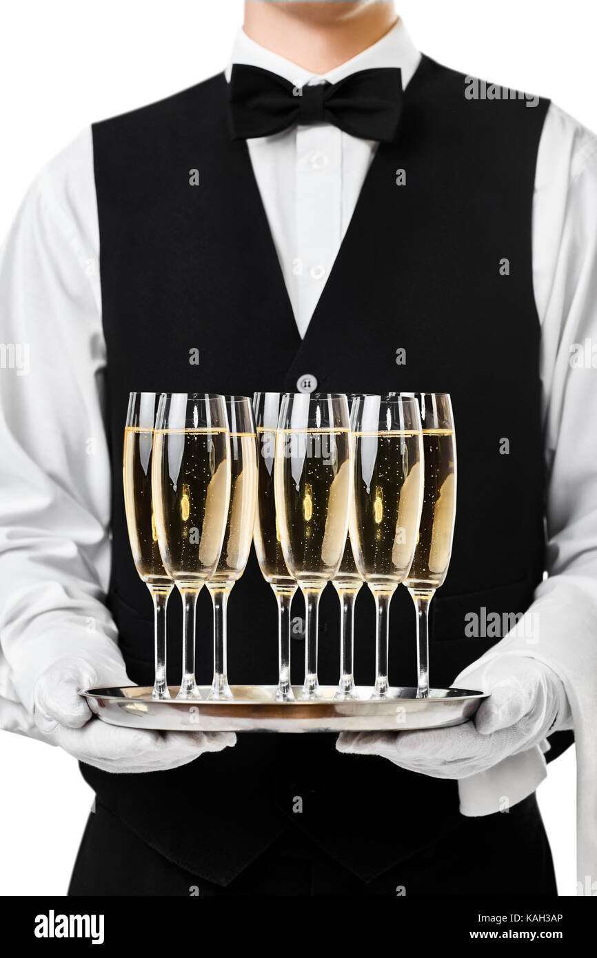 Elegant waiter serving champagne on a tray Stock Photo - Alamy