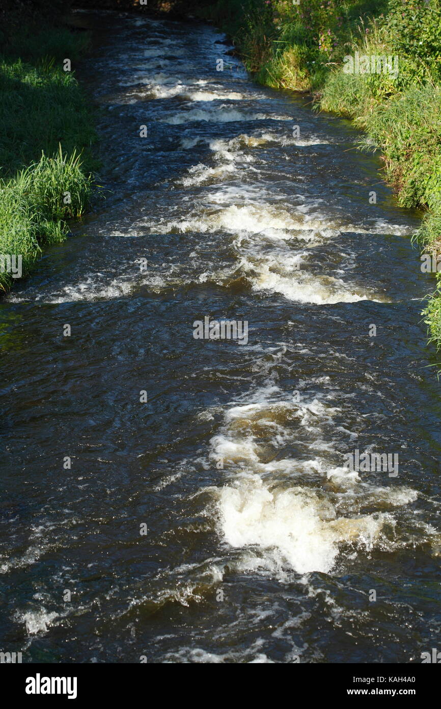 river with rushing water and plants Stock Photo - Alamy