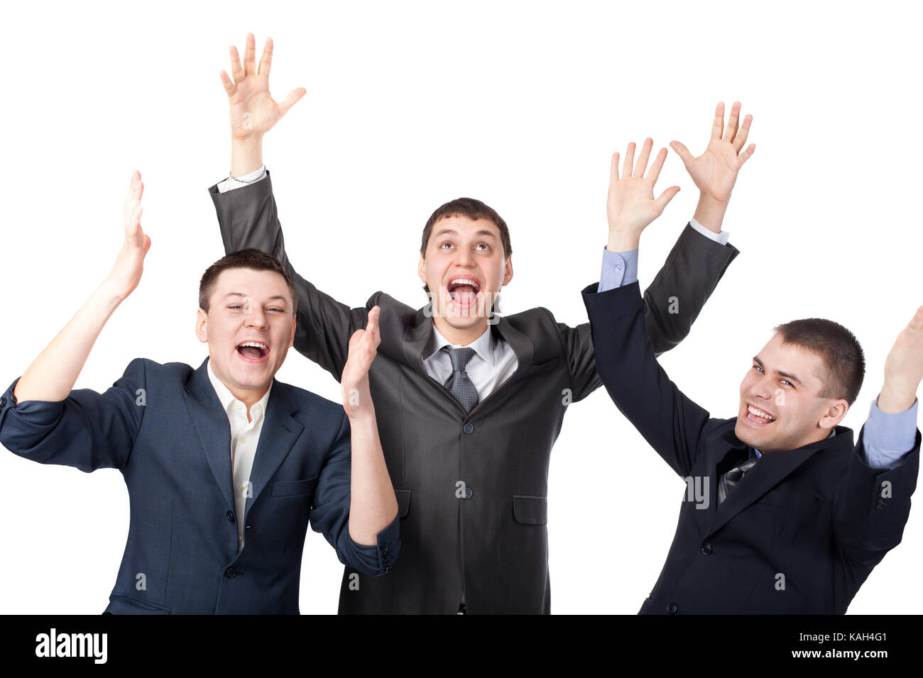 Successful young businesspeople raising hands isolated on white ...