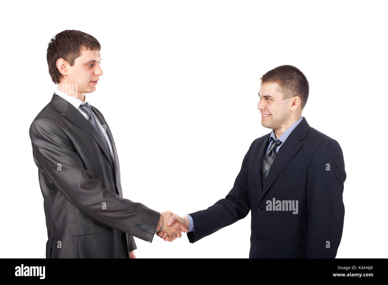 Young business men shaking hands isolated on white background Stock ...