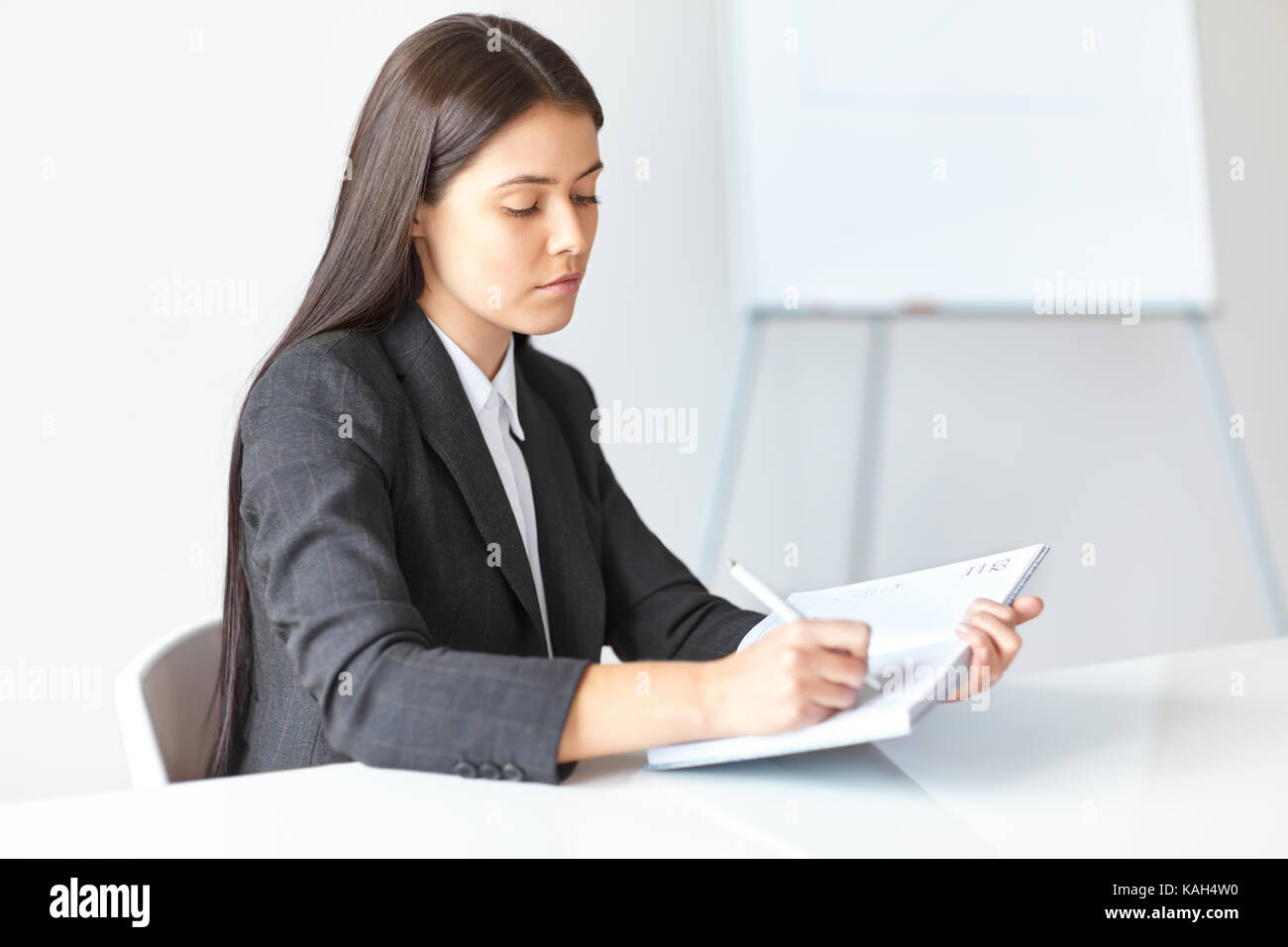 Young beautiful business woman working in the office Stock Photo - Alamy