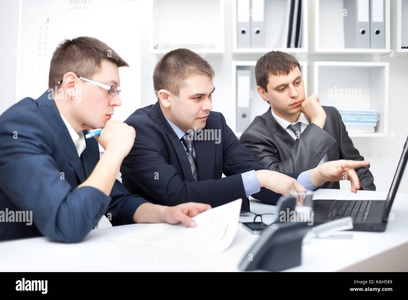 Team of young business men working together at office Stock Photo - Alamy