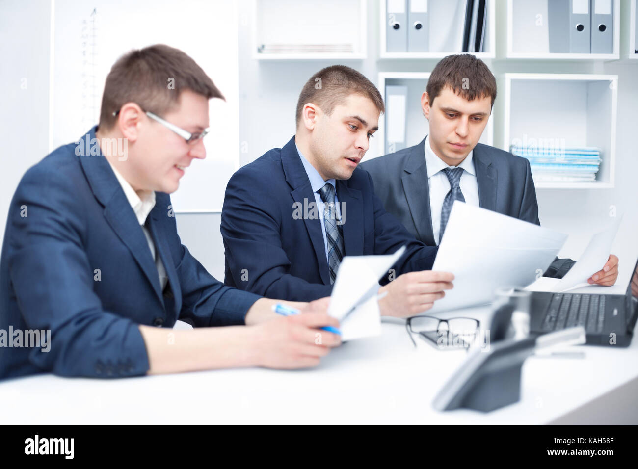 Team of young business men working together at office Stock Photo - Alamy