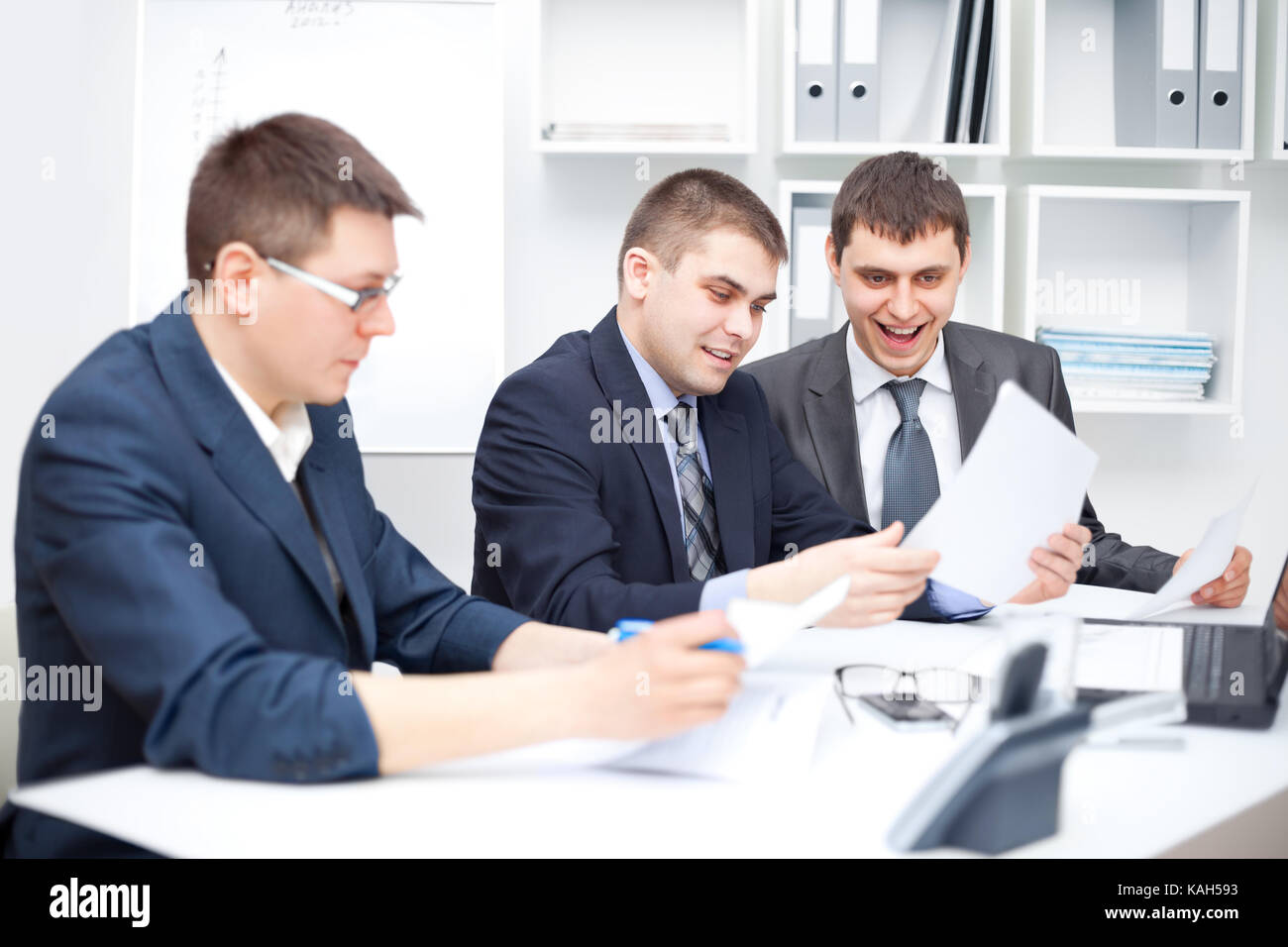 Team of young business men working together at office Stock Photo - Alamy