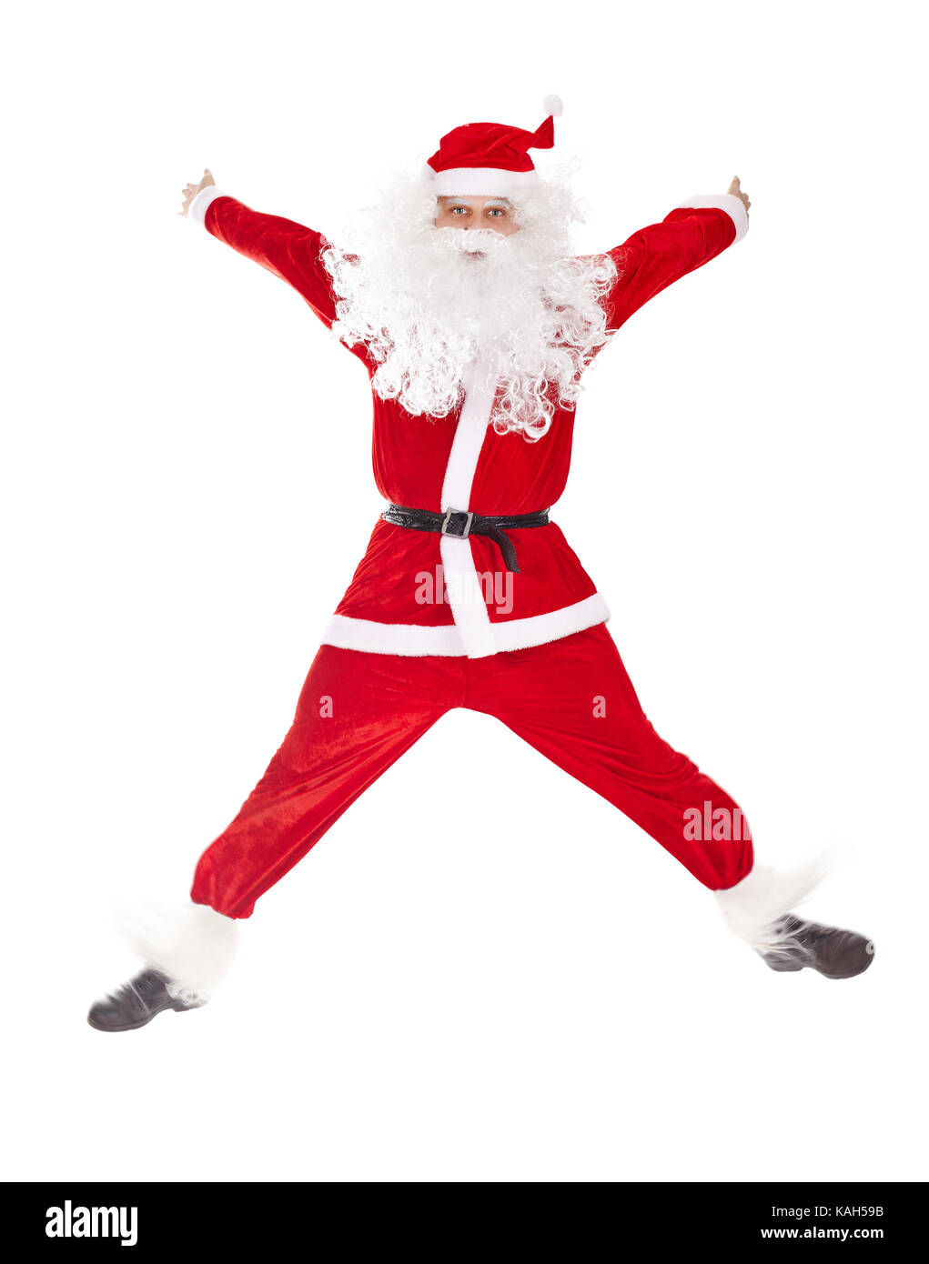 Santa Claus jumping with hands lifted upwards isolated on white ...