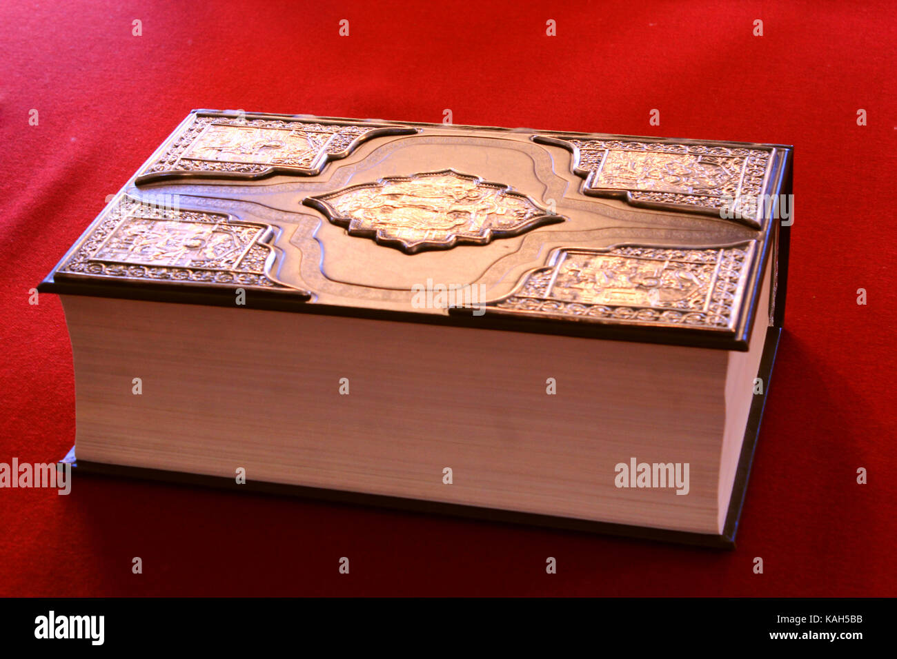 ancient thick book on the vintage red table Stock Photo - Alamy
