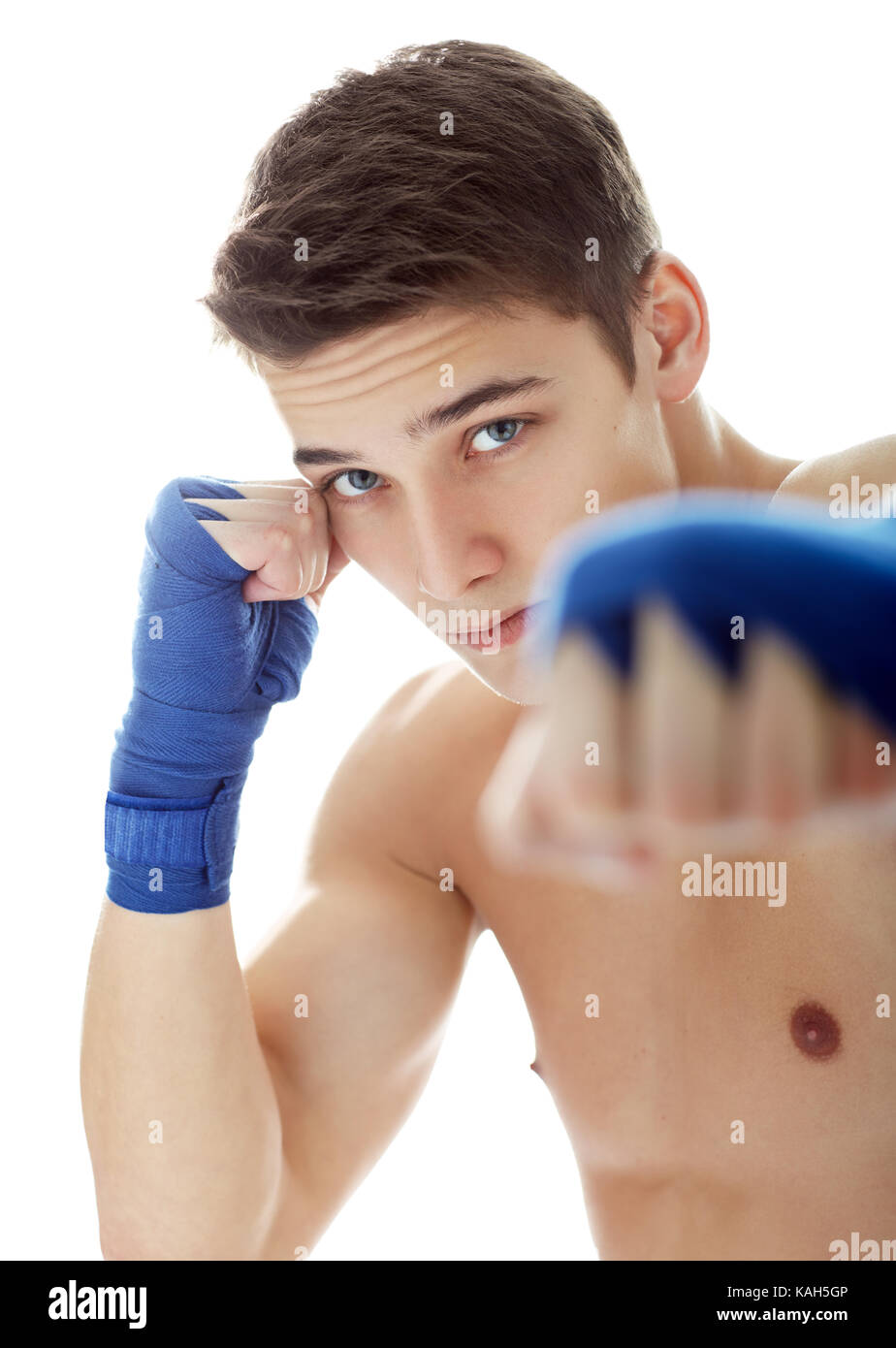 Portrait of muscular young male fighter with blue boxing bandages on ...