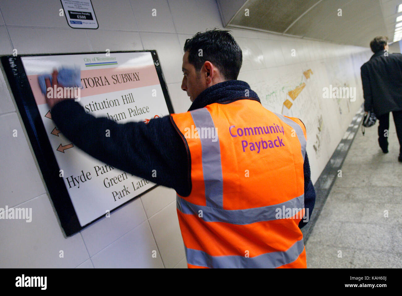 Offenders cleaning the tunnel walls of Hyde Park Corner tube as part of ...