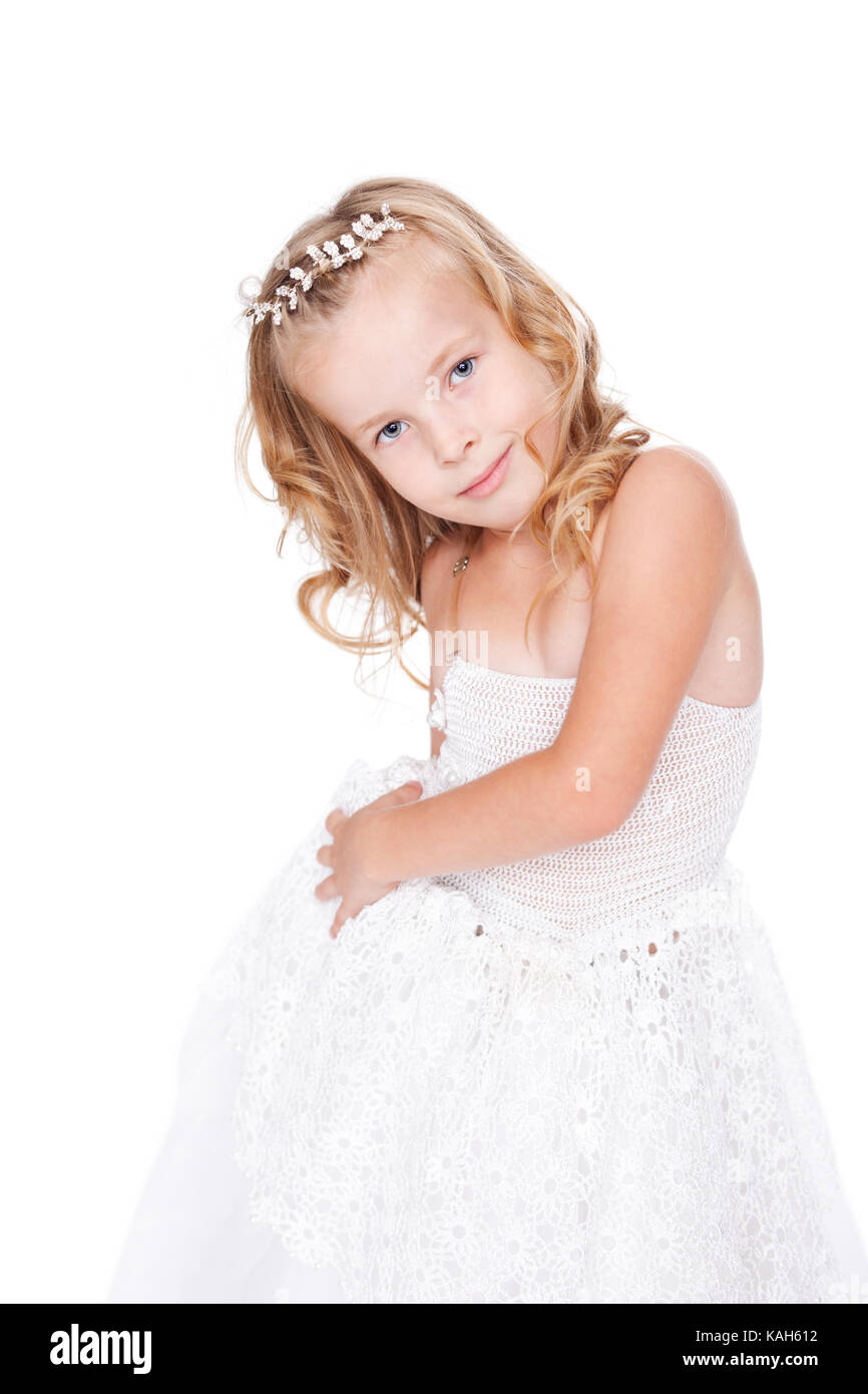 pretty little girl in beautiful white dress isolated on white ...