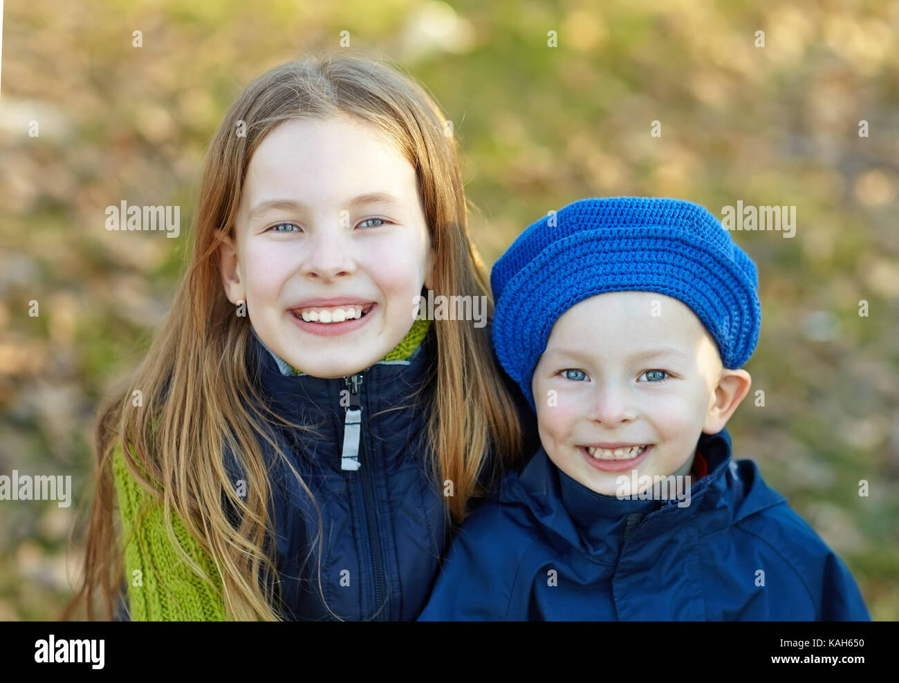 Happy sister and brother having fun in autumn park. Happy lifestyle kids Stock Photo - Alamy