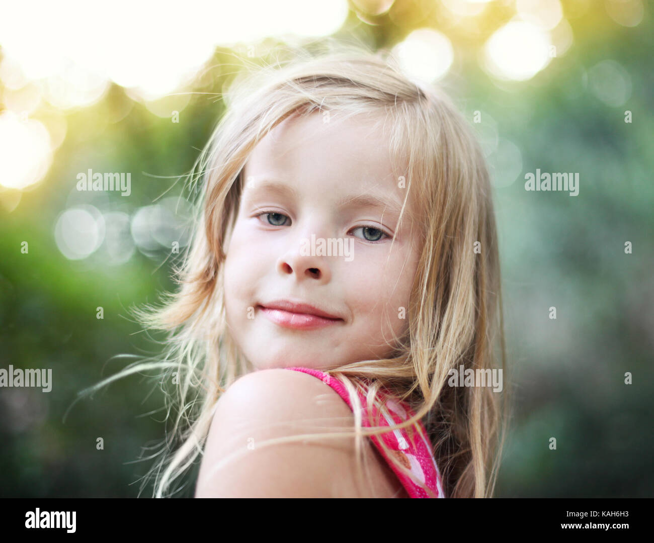 Portrait of the beautiful blonde little girl on nature Stock Photo - Alamy