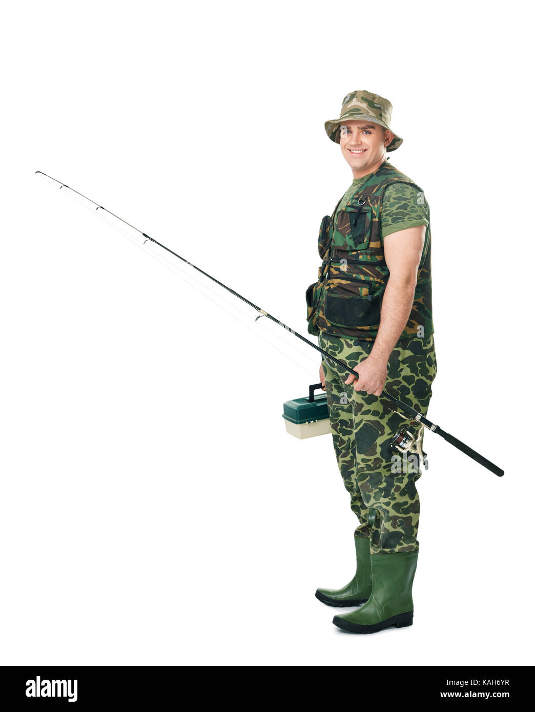 Full length side view portrait of a young happy smiling fisherman in ...