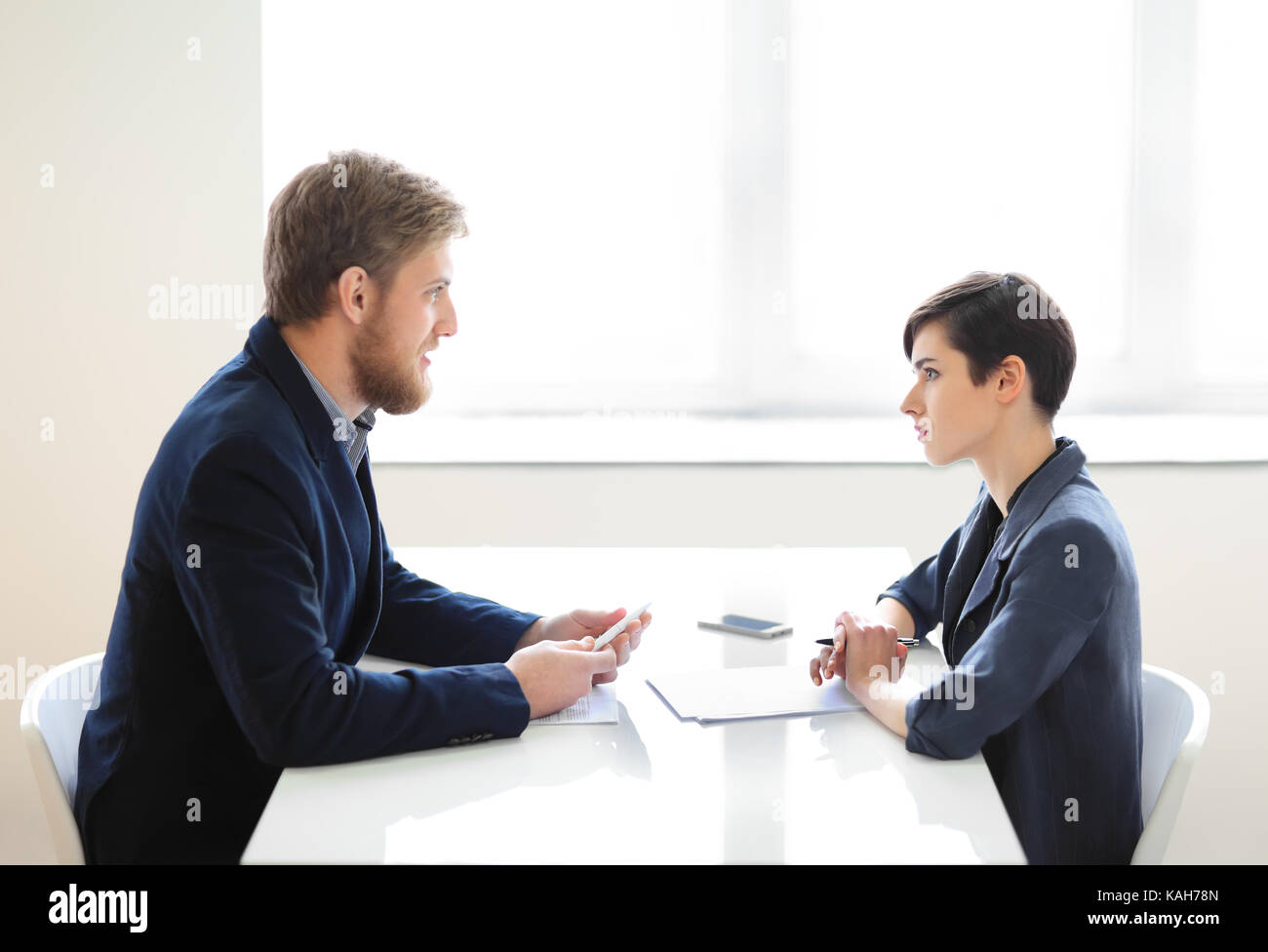 Businessman and businesswoman having interview in the office Stock ...