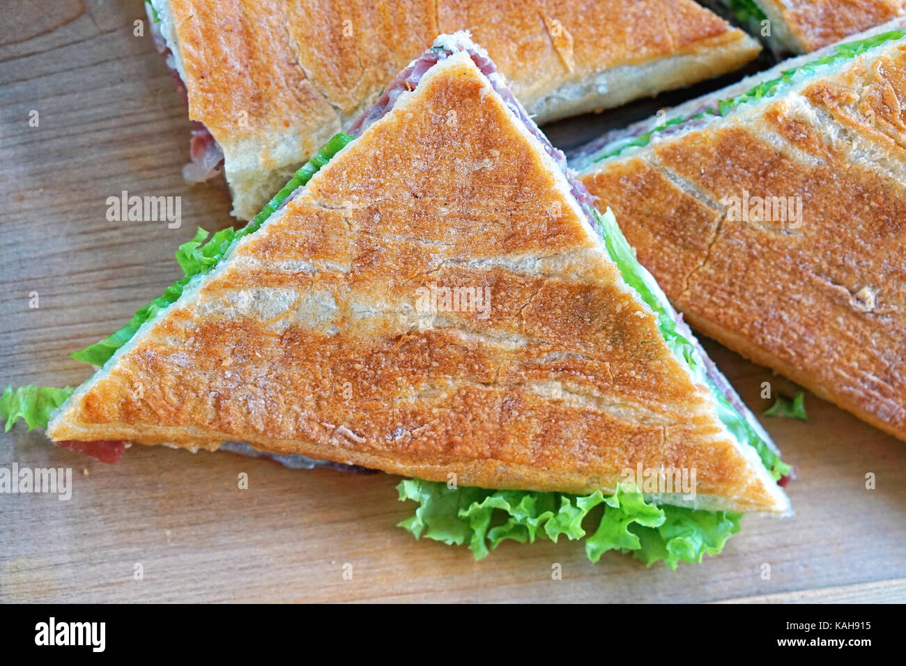 Diagonally cut triangular toast sandwiches Stock Photo - Alamy