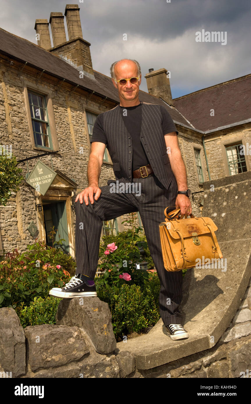 Roger Saul (holding his first Mulberry creation, a briefcase), founder ...