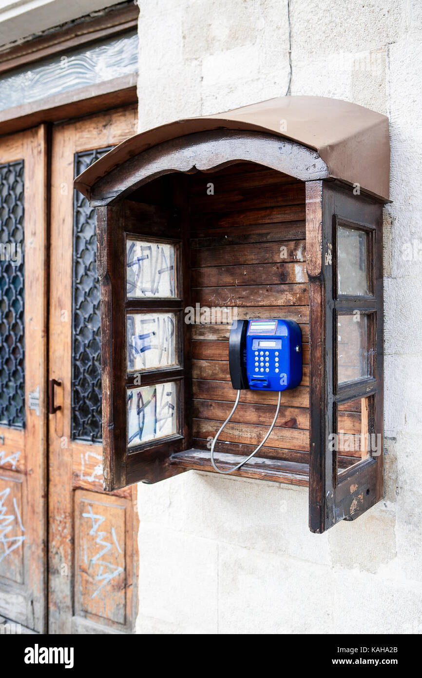 old blue pay phone on the wall. phone booth Stock Photo - Alamy