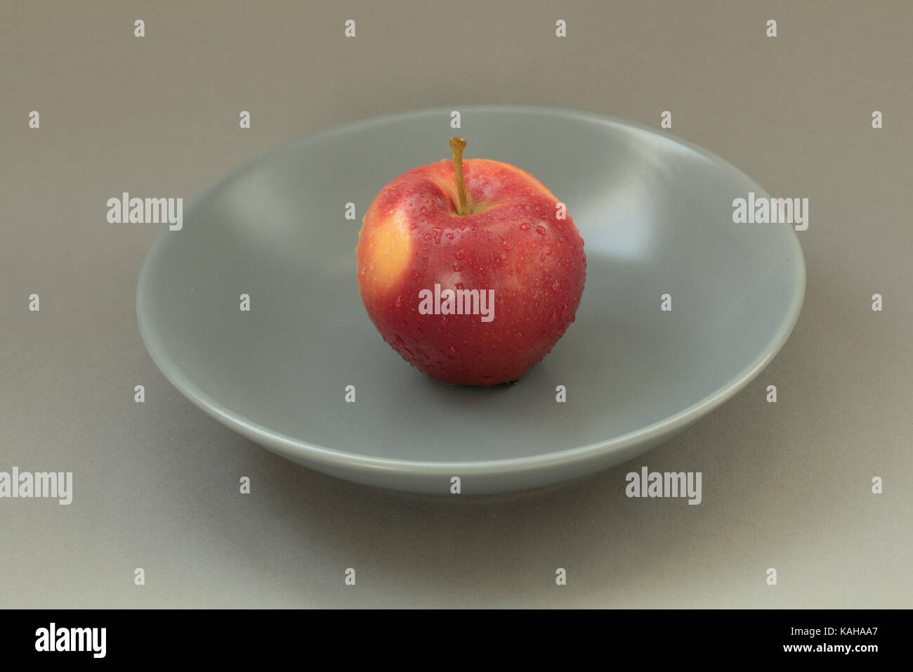 Red apple on table Stock Photo - Alamy