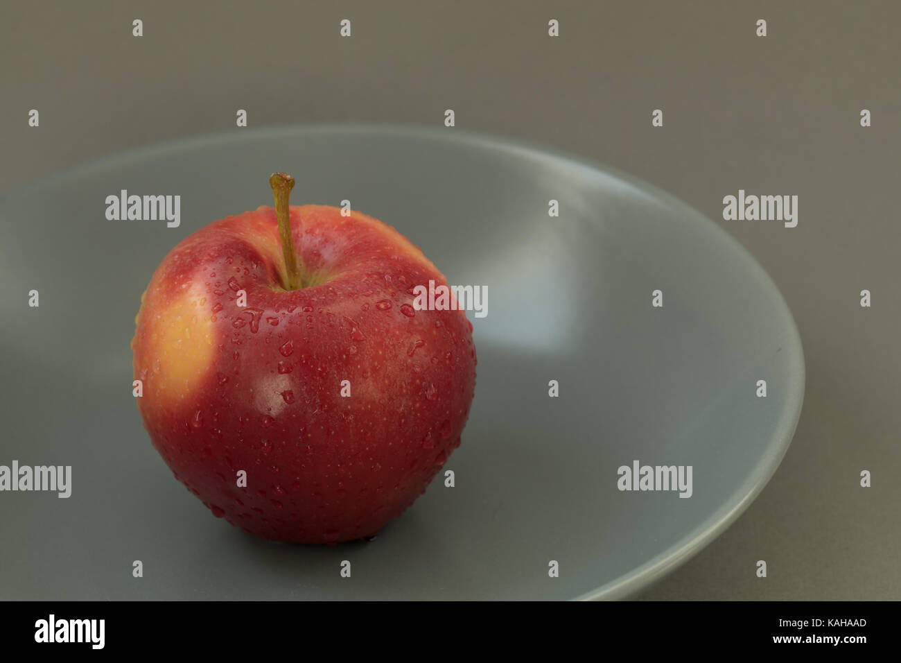 Red apple on table Stock Photo - Alamy